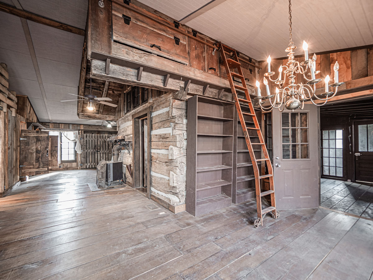 Wilson Auctions | UNIQUE LOG CABIN HOME ON .23 AC LOT